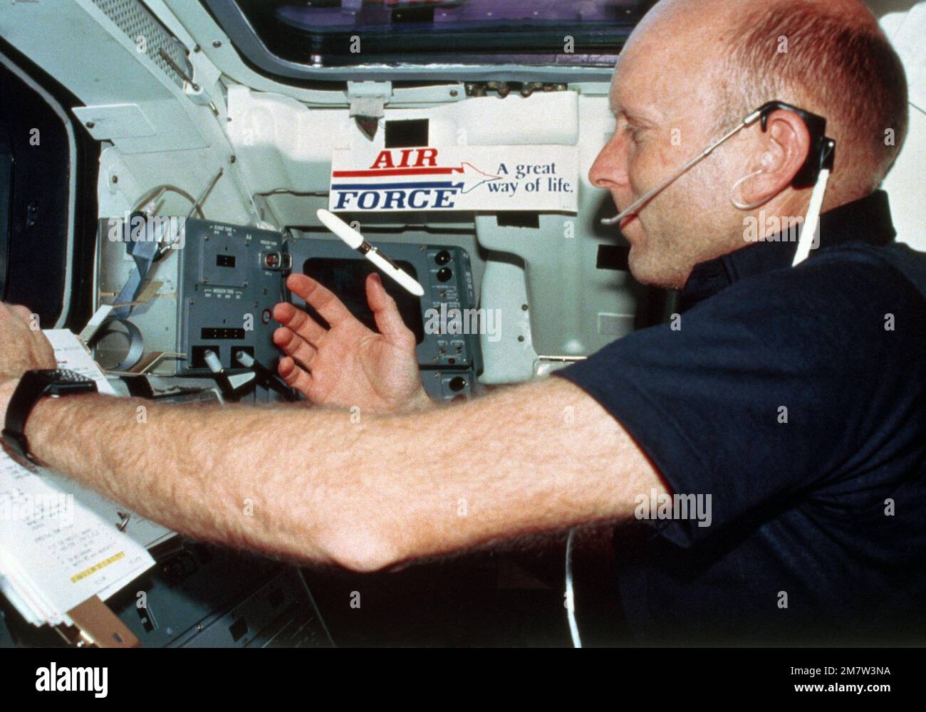 Air Force Colonel Gordon Fullerton, space shuttle pilot on Columbia's third flight, watches as ...